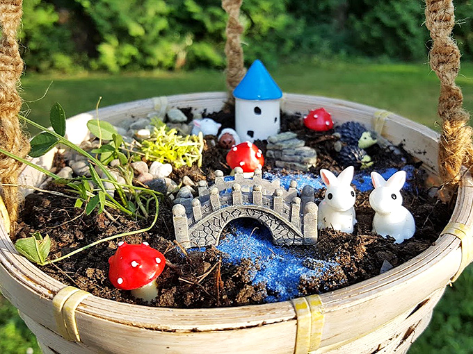 Mini Hanging Fairy Garden Basket: A complete fairy ecosystem in a basket - proving good things come in small packages, especially with tiny bunnies included.