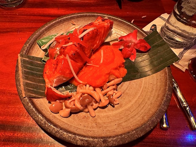 This isn't just salmon &ndash; it's a miso-glazed flavor bomb served on a banana leaf with garnishes so pretty you'll hesitate before demolishing the entire presentation.