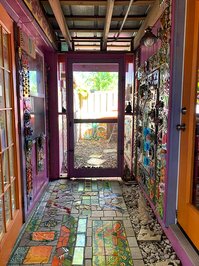 This hallway isn't just a path from one room to another &ndash; it's a journey through an artistic wonderland framed in vibrant purple.
