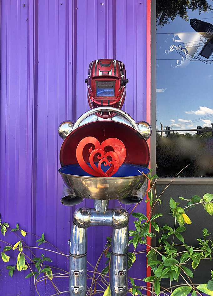 Not your average Valentine – this metal robot offers its heart chamber for all to see, proving even scrap metal can feel love.