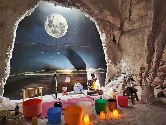 The salt therapy cave glows with ethereal moonlight, creating an atmosphere where your lungs might actually write thank-you notes if they could.
