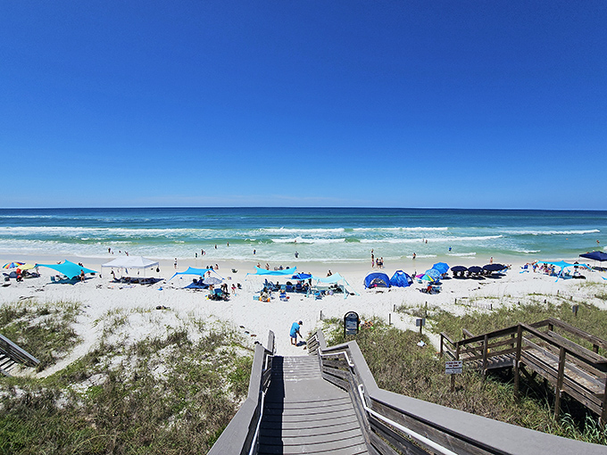 Beach day perfection: Santa Clara's access point welcomes visitors to a postcard-worthy scene where the Gulf of Mexico shows off its most dazzling blue-green hues.
