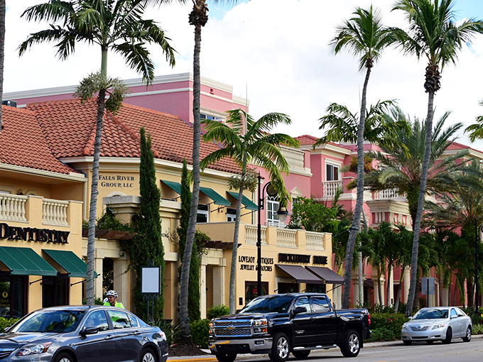 Pastel-colored buildings line the street like a row of tropical treats, housing boutiques that beckon with promises of unique finds.