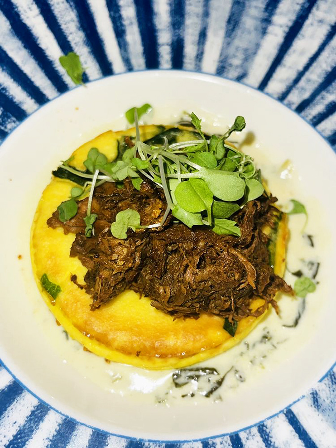 The star player of Spurrier's menu rests on a bed of creamy polenta, tender enough to surrender at first fork touch, crowned with fresh microgreens for a championship-worthy presentation.