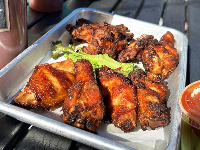 These aren't just wings &ndash; they're smoke-kissed masterpieces with a mahogany crust that crackles between your teeth.
