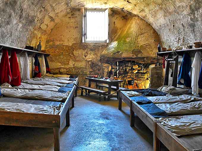Simple wooden bunks line the soldiers' quarters. Imagine the snoring contests that must have echoed off these ancient walls nightly.