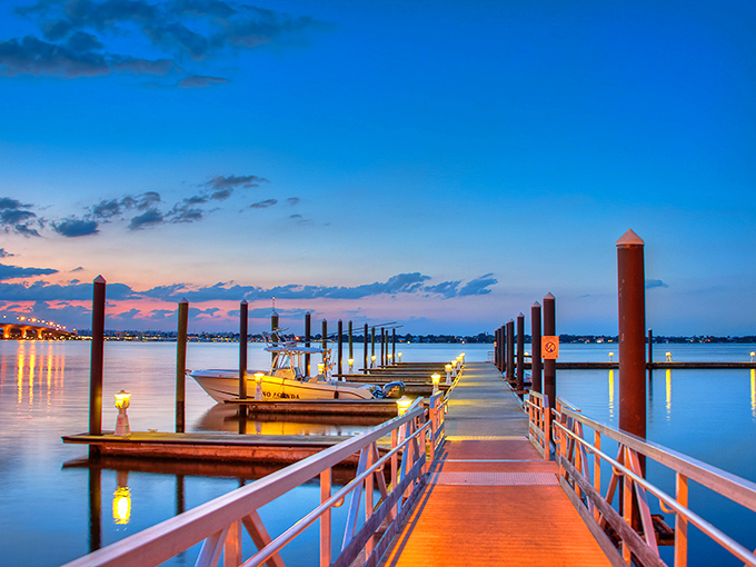Sunset paints the marina in golden hues as boats rest after a day of adventure on Stuart's legendary fishing waters.
