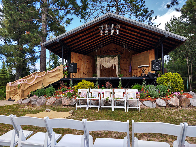 This rustic performance stage nestled among the pines hosts occasional events, transforming the sculpture park into a community gathering space.