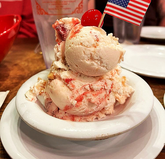 Patriotism never tasted so sweet &ndash; this strawberry cheesecake creation proudly waves its tiny flag over a mountain of creamy indulgence.