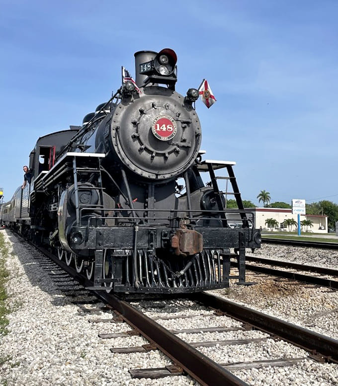 Locomotive No. 148 poses like it knows it's photogenic, all gleaming metal and purposeful design, ready to pull passengers into Florida's agricultural heartland.
