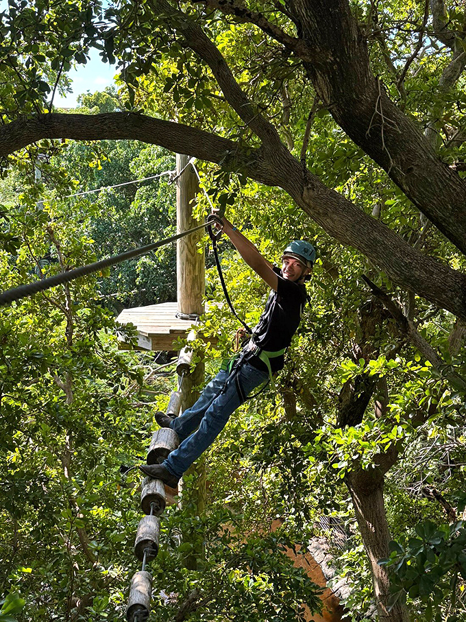 Balancing act meets nature therapy. This suspended log bridge challenges your core while treating your eyes to a lush green panorama.
