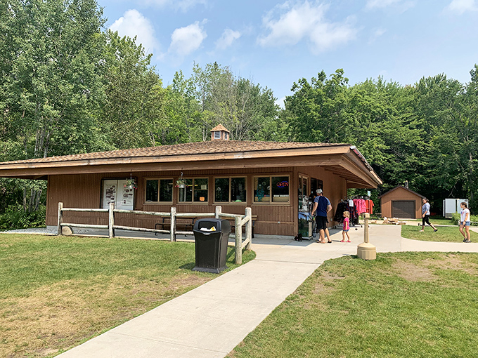 The visitor center welcomes explorers with rustic charm, standing as a humble gatekeeper to the natural wonders that lie beyond.