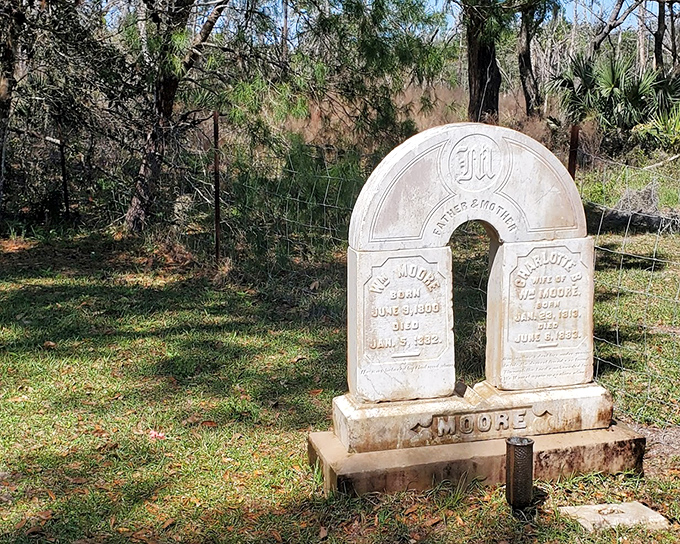 W. Moore & Charlotte Moore Tombstone: "Father & Mother" united in stone as they were in life, their shared monument whispering tales of early Florida resilience.