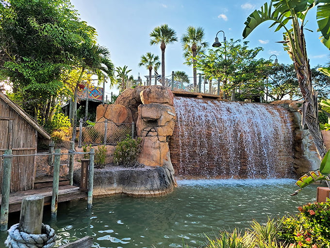 Water cascades dramatically over ancient-looking rocks, creating both a stunning backdrop and the soothing soundtrack to your game.