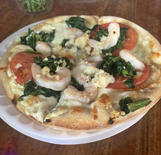 Ocean meets artisan crust in this Keys-inspired masterpiece, where plump shrimp nestle among spinach, tomatoes, and creamy ricotta.