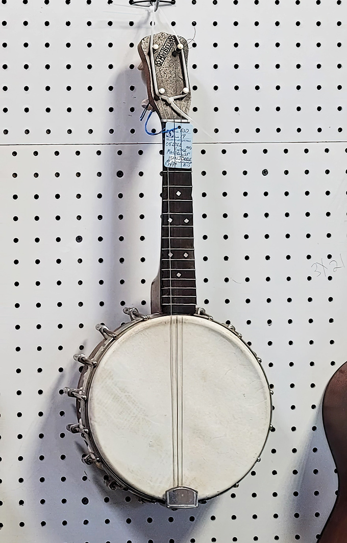 Not just any banjo ukulele – this stringed time capsule has probably serenaded more front porches than your Spotify playlist ever will.