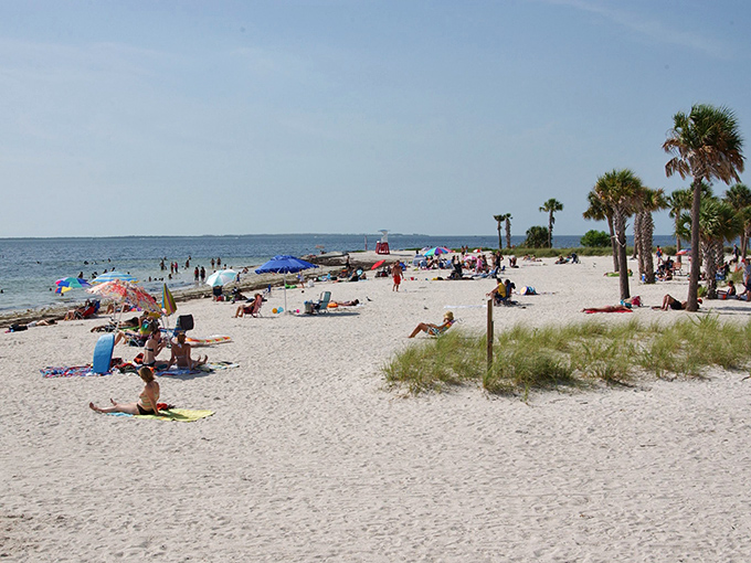 Pristine white sands meet gentle Gulf waters, creating the perfect playground for beachgoers of all ages.