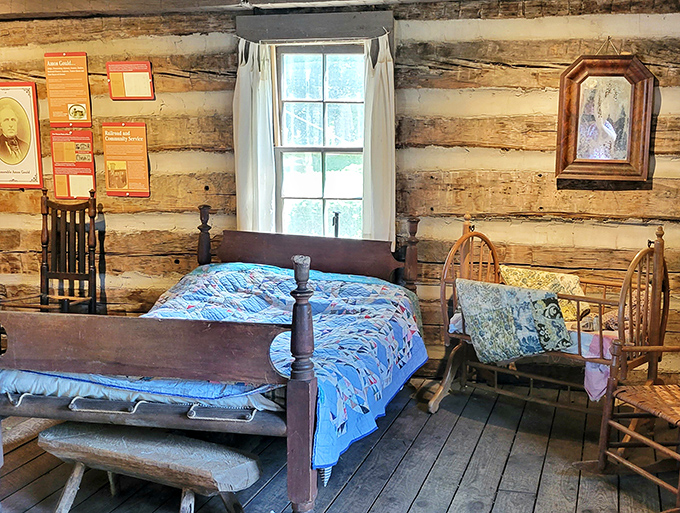 Pioneer simplicity captured in this rustic bedroom at Comstock Cabin, where history whispers through the rough-hewn log walls.