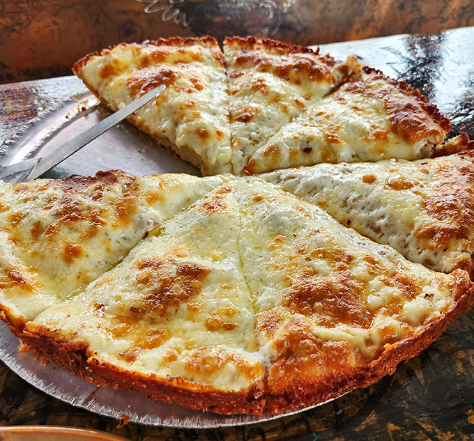 The holy grail of Florida pizza – a cheese-laden masterpiece with edges caramelized to golden perfection. Worth every minute of the wait.