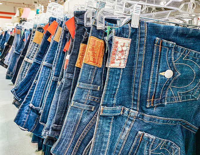Denim heaven awaits the patient hunter – rows of jeans from premium brands to everyday favorites, all at prices that make retail seem ridiculous.