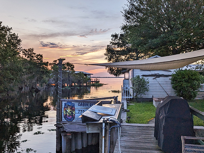 Sunset transforms a simple lakeside cabin into waterfront luxury, where million-dollar views come with the rustic charm of Old Florida.