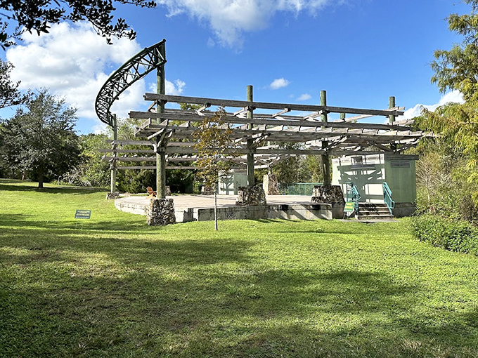 This open-air stage structure stands as a silent sentinel, waiting for its next performance amid lush surroundings.
