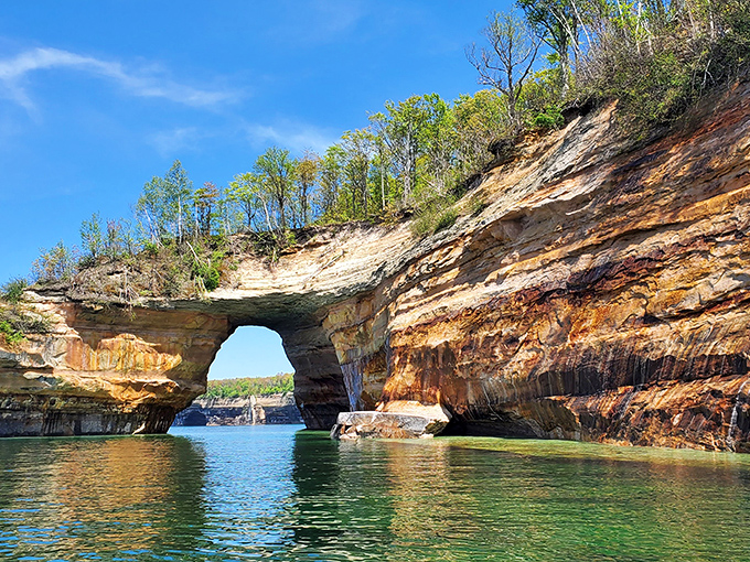 This natural arch seems to defy gravity, sculpted by centuries of persistent waves and Michigan's dramatic freeze-thaw cycles.