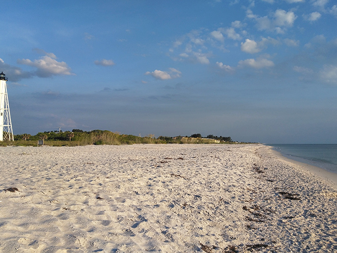 Pristine white sands stretch toward the horizon, offering a blank canvas for footprints and daydreams along Boca Grande's unspoiled coastline.