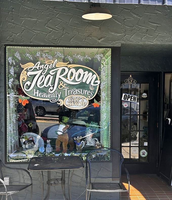 Angel Tea Room's charming storefront window displays its heavenly name alongside teacups and treasures waiting to be discovered.