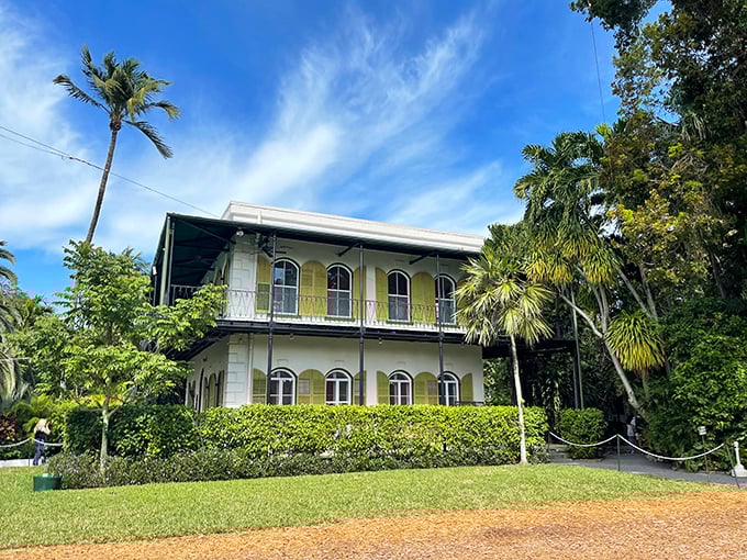 This historic white house, trimmed with sunny yellow windows and surrounded by wrap-around porches, feels like a peaceful writer's retreat in the heart of bustling Key West.