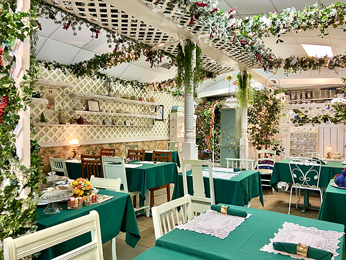 Inside, a garden-inspired tea room blooms with greenery, floral tablecloths, and vintage china for a truly angelic experience.