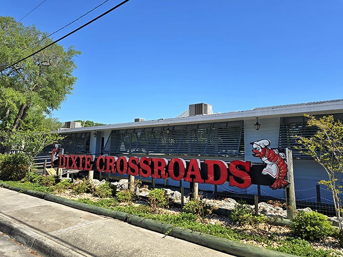 The restaurant's retro design with its curved metal roof and colorful awning stands as a landmark for hungry travelers seeking authentic Florida seafood.