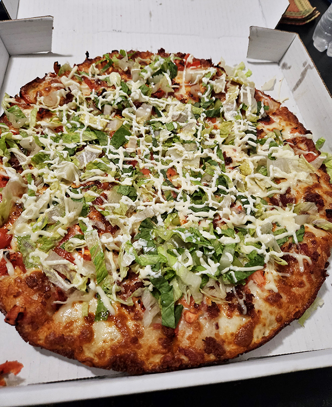 Their BLT pizza reinvents the classic sandwich, with fresh lettuce adding a crisp contrast to the warm, cheesy base.