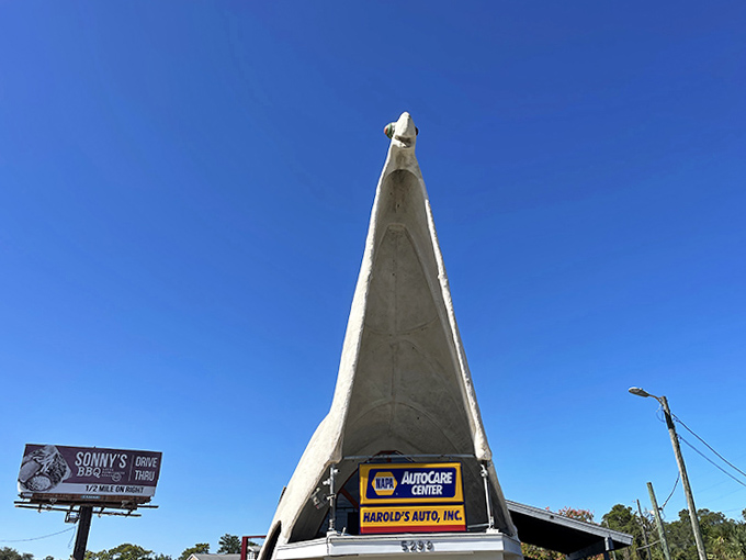 The dinosaur's distinctive profile creates an unmistakable silhouette, making "turn at the dinosaur" perfectly clear driving directions.