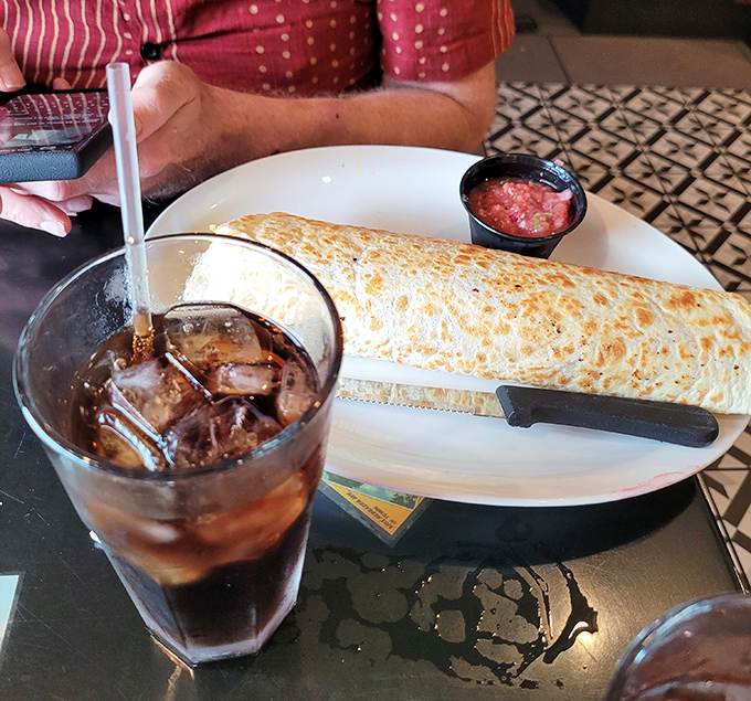 When your burrito is so substantial it needs its own zip code, washing it down with a cold drink becomes essential strategy.