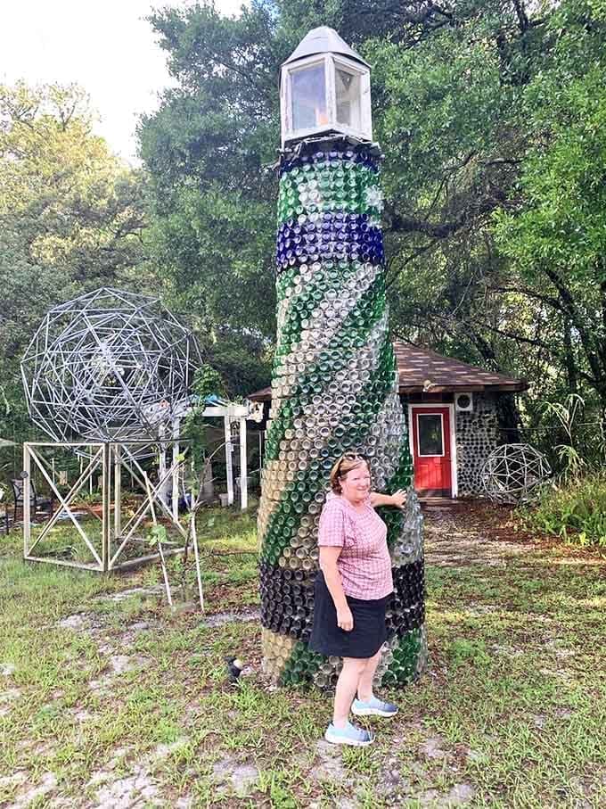 The bottle tower stands tall enough to make visitors look like they've stumbled into a fairy tale where recycling meets artistic vision.