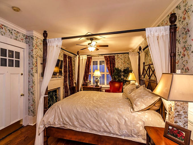 Four-poster beds with flowing curtains create romance novel vibes, assuming the novel includes a friendly ghost or two.