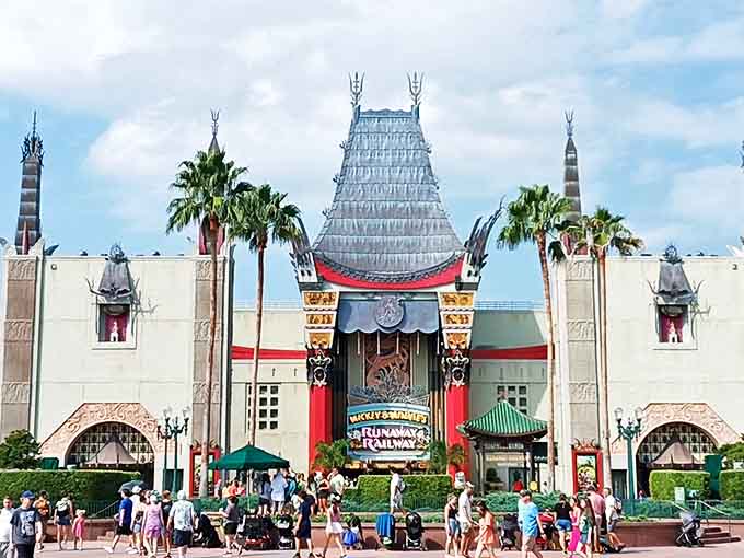 The Chinese Theater stands majestically at the park's center, housing Mickey & Minnie's Runaway Railway where cartoon physics make perfect sense.