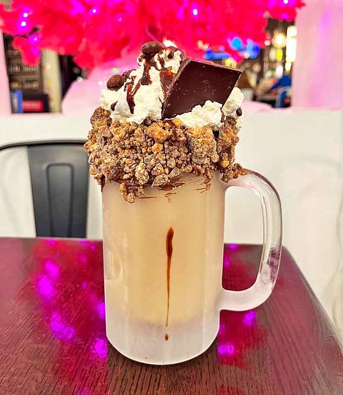 Chocolate and peanut butter unite in perfect harmony &ndash; this towering Reese's creation makes you question whether it's a drink or an architectural achievement.