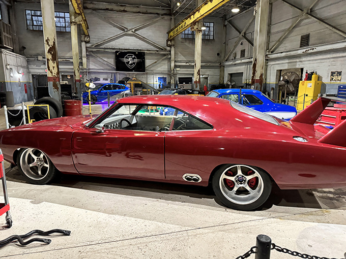 This cherry-red classic isn't just eye candy &ndash; it's automotive history with attitude, parked perfectly for your nostalgic photo opportunity.