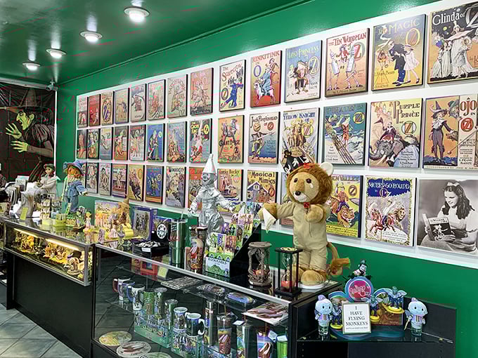 A treasure trove of Oz memorabilia lines the walls, with vintage posters chronicling decades of the Wizard's cultural impact.