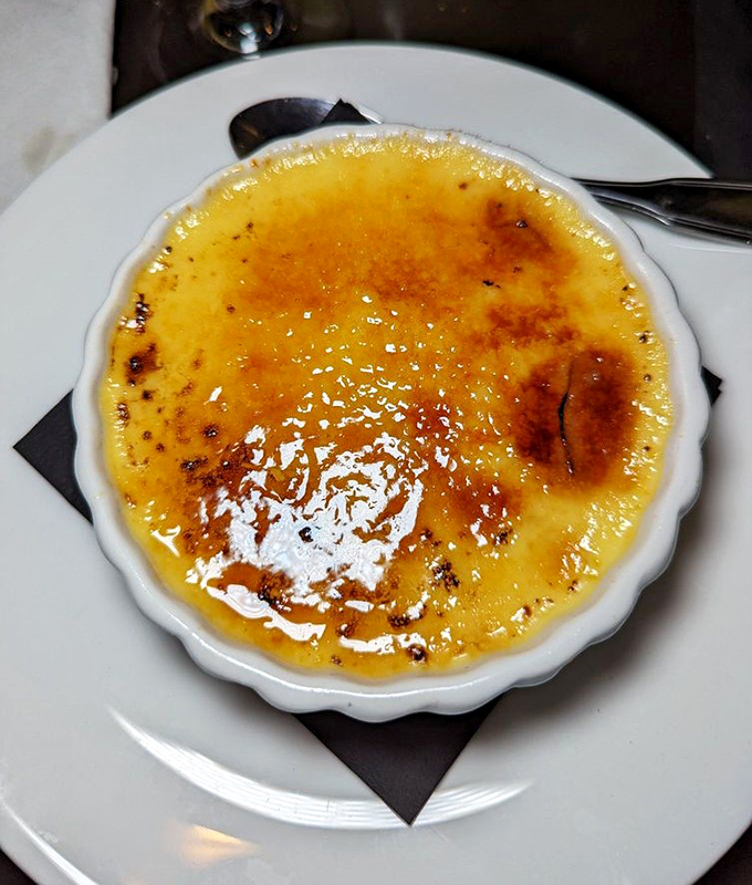 Creme Brulee: The satisfying crack of caramelized sugar gives way to silky custard beneath &ndash; a timeless dessert that proves some classics need no reinvention.