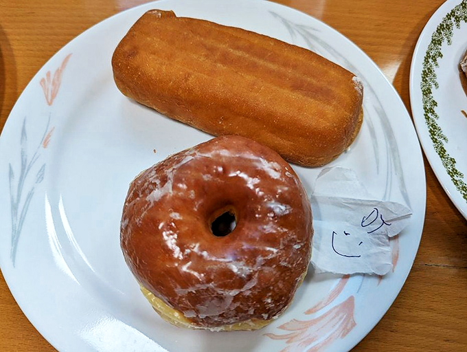 A perfect pairing: the iconic Long John alongside a classic glazed donut &ndash; like Batman and Robin, if they were delicious and didn't fight crime.