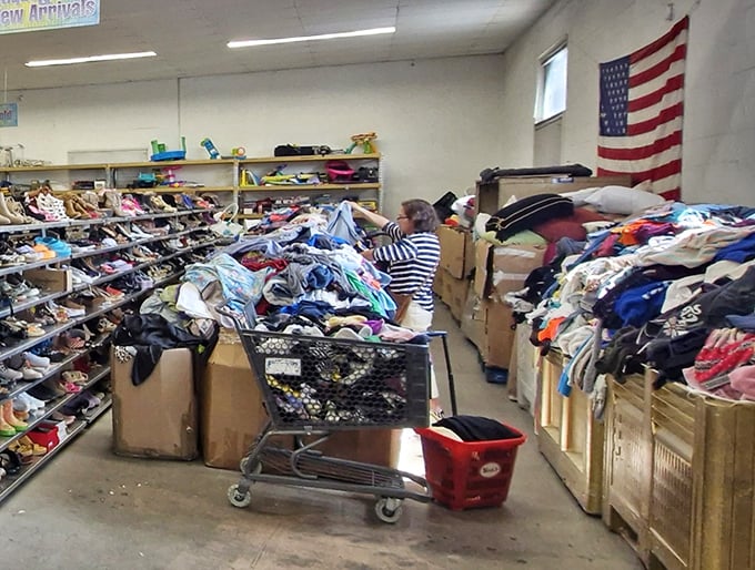 Treasure hunting in action &ndash; where determination meets patience as shoppers sift through mountains of potential finds like archaeologists at a promising dig site.
