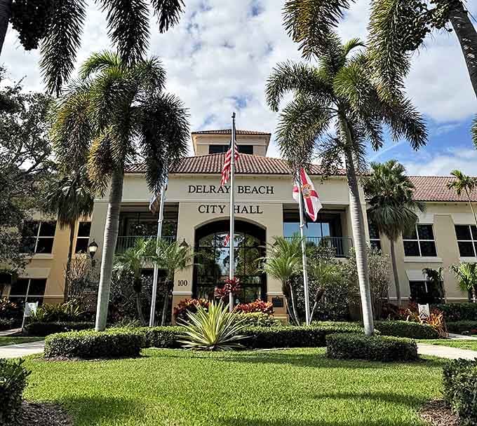 Civic pride meets Mediterranean elegance at this palm-flanked municipal building where community decisions shape paradise.