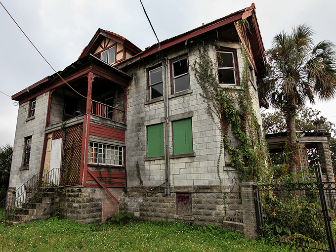 Nature's slow reclamation project continues as vines embrace stone walls that once represented the pinnacle of Jacksonville society.