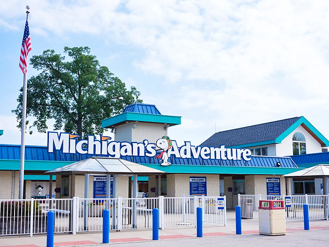 Michigan's Adventure entrance sign stands like a gateway to joy, promising a day where responsibilities fade and fun takes center stage.