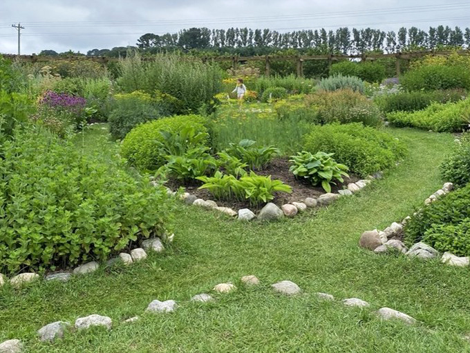 Garden beds curve like nature's smile, showcasing the thoughtful design that makes Cherry Point more than just a pretty face.