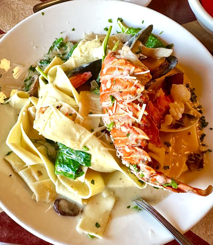 The Lobster Pasta Capriccio showcases Florida's seafood bounty with tender lobster meat nestled among wide pasta ribbons in a delicate cream sauce.