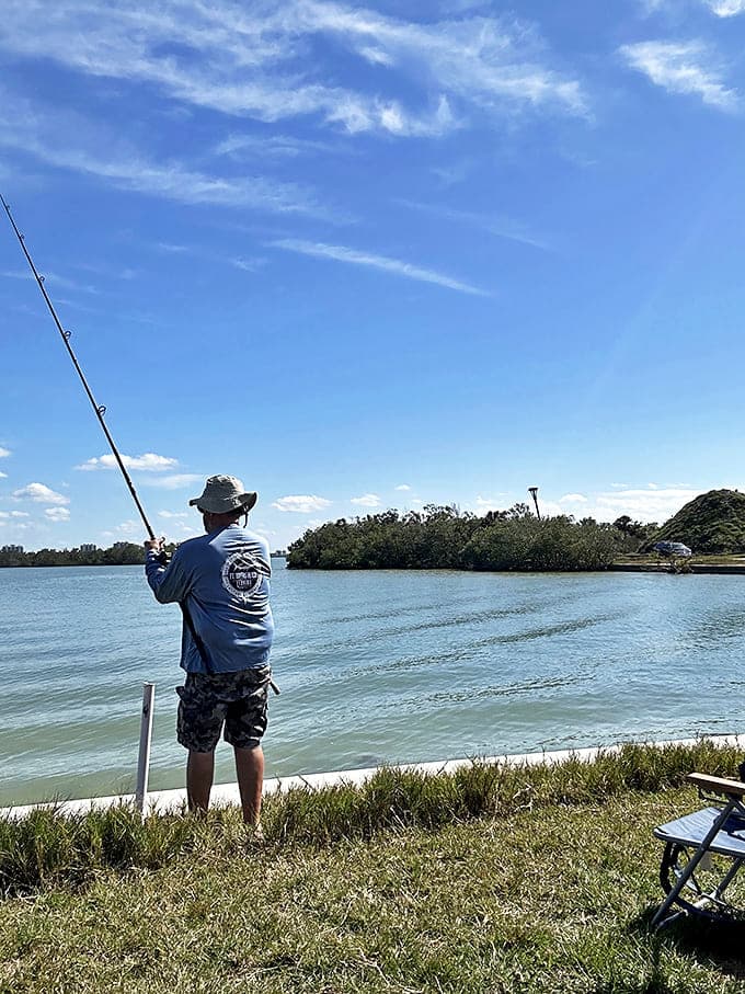 A patient angler casts hopes and dreams into the gentle current, where fish stories are born with every cast.